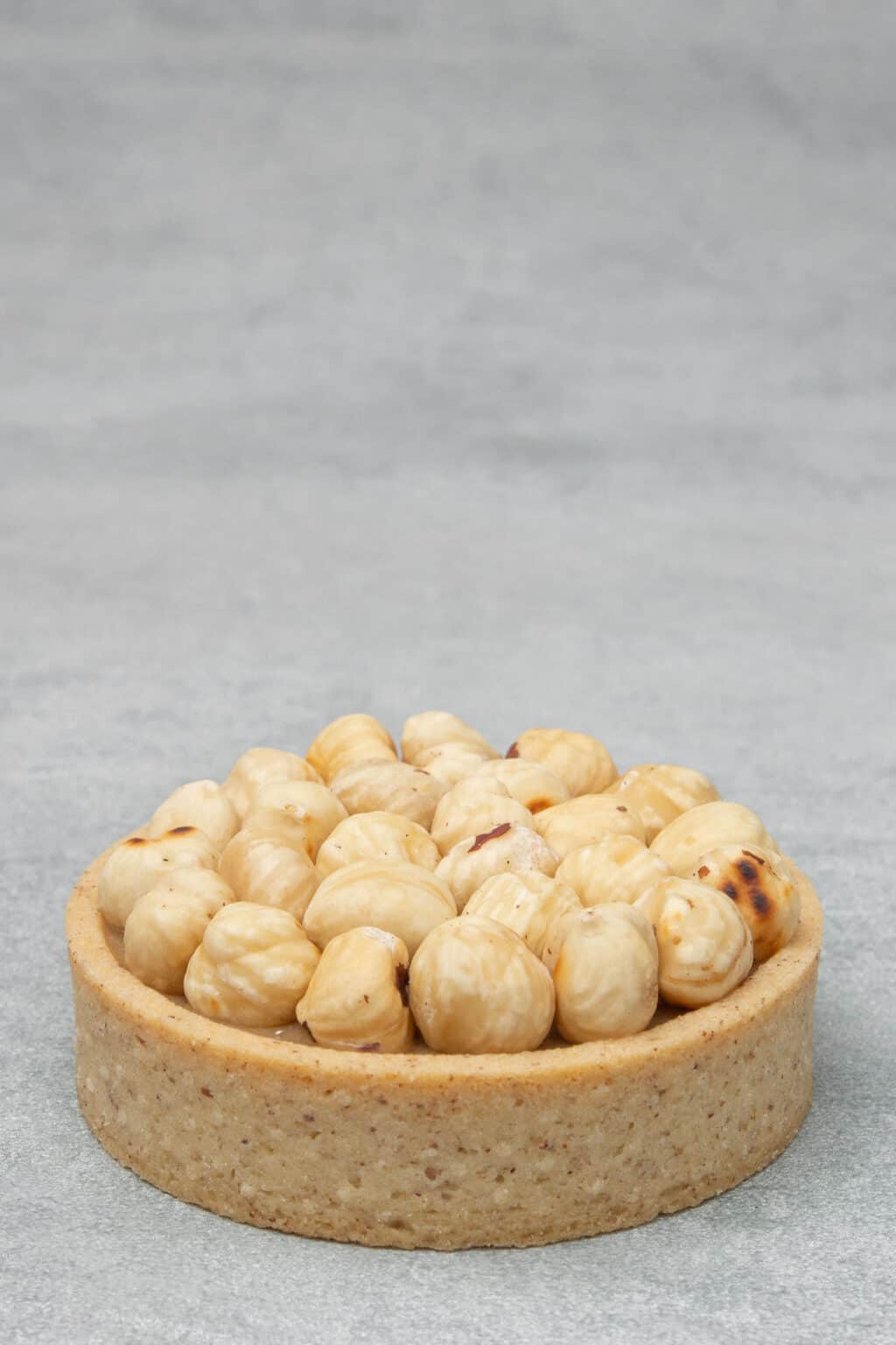 Triple Hazelnut Tart With Gold Chocolate Disk Decoration | Spatula Desserts